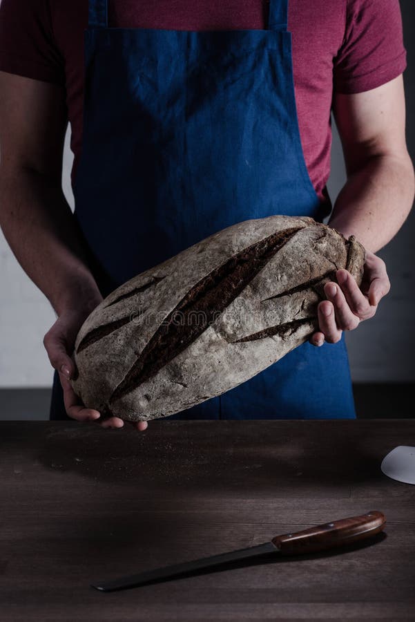 Baker holding bread stock photo. Image of bread, taste - 126694394
