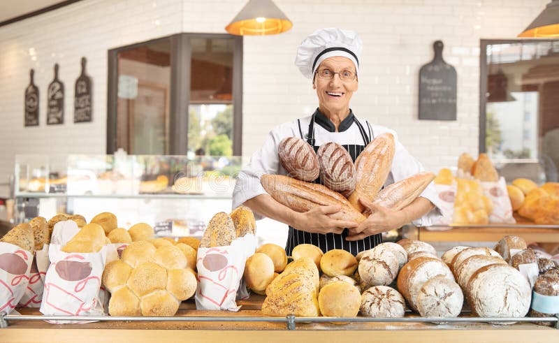 Baker Holding Breads in a Bakery Stock Photo - Image of looking, male ...
