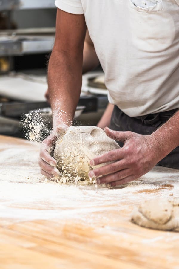 A Baker Kneads Bread Dough in the Bakery Stock Photo - Image of ...