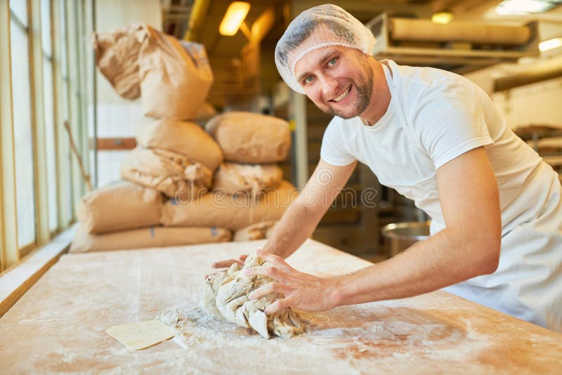 Baker Kneads Dough in Preparation for Baking Bread Stock Photo - Image ...