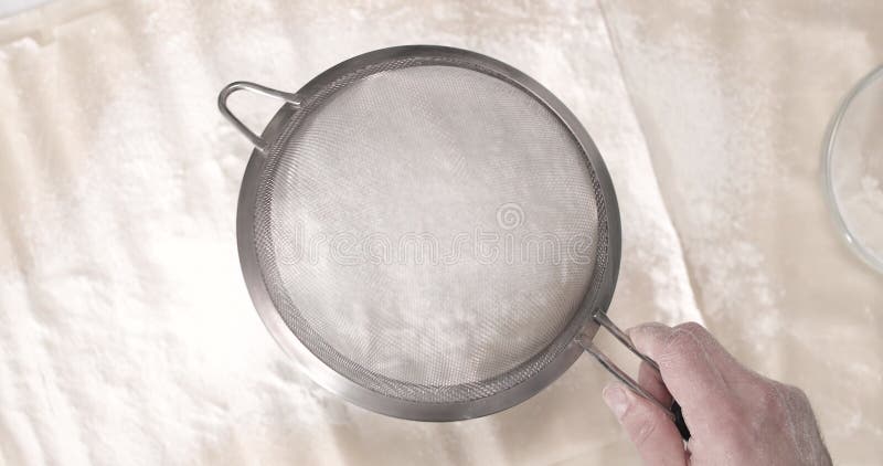 The Baker Lays the Sieve on the Table after Sifting the Flour. Stock ...