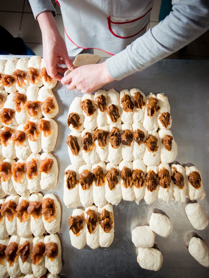 Baker Make Buns with Filling of Jam and Condensed Milk from Dough Stock ...