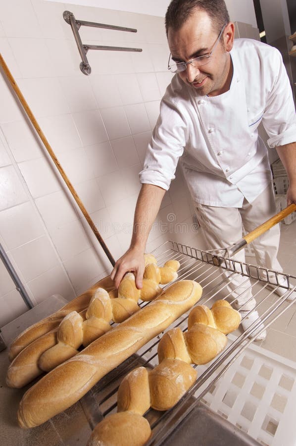 Baker in His Bakery Baking Bread Stock Photo - Image of clothes, bakery ...