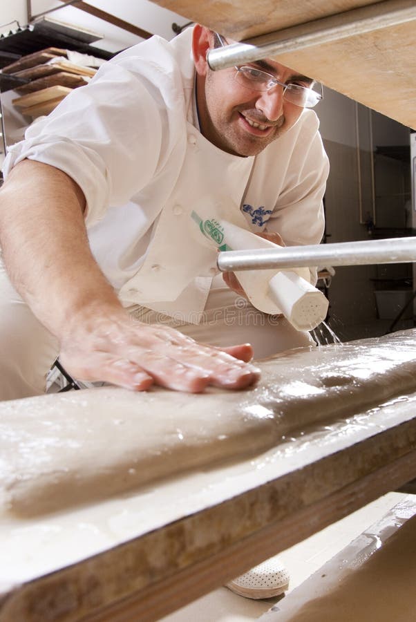 Baker makes the bread stock image. Image of indoors, manual - 24078309
