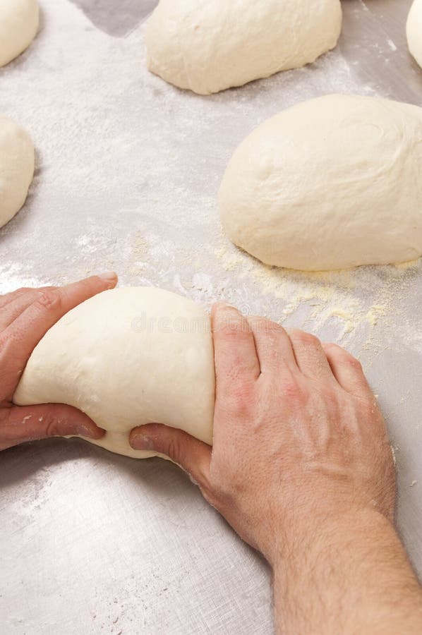 Baker makes the bread stock image. Image of hands, bakery - 24078483