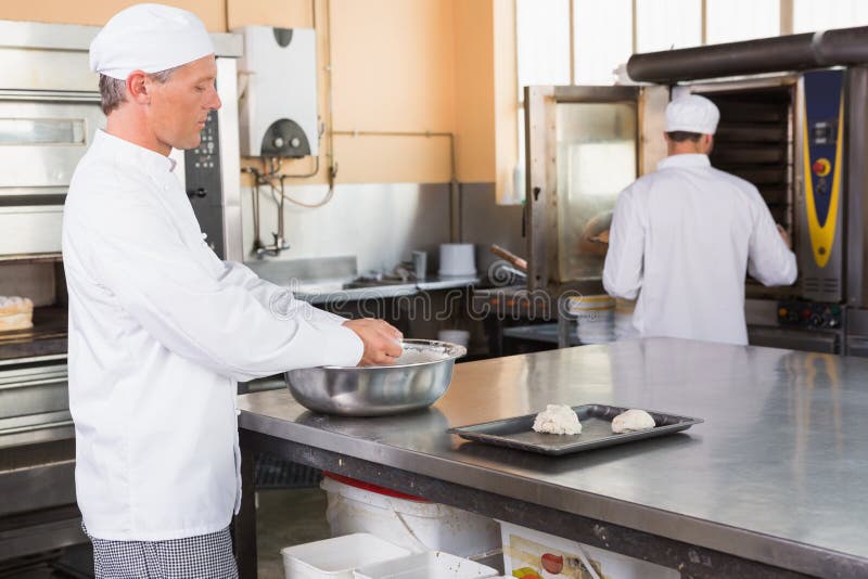 Baker Making Dough in Mixing Bowl Stock Photo - Image of adult, holding ...