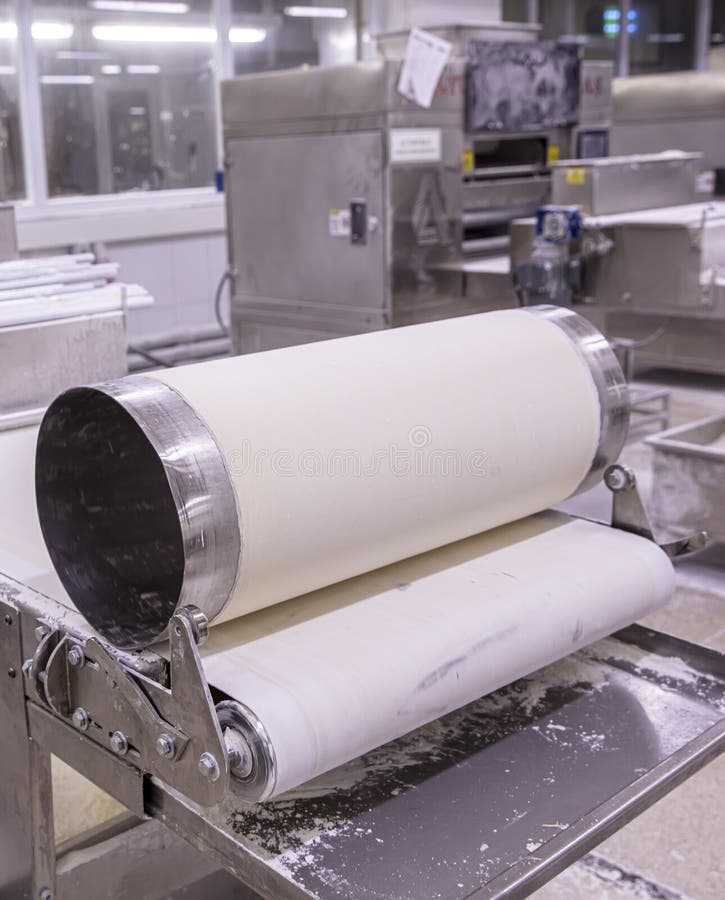 Baker Making Dough for Pastry on Dough Sheeter. Dough Rolling Machine ...