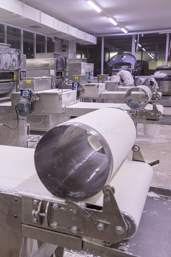 Baker Making Dough for Pastry on Dough Sheeter. Dough Rolling Machine ...