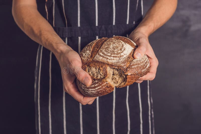 Baker Man Holding Homemade Rustic Wheat Bread in Hands. Selective Focus ...