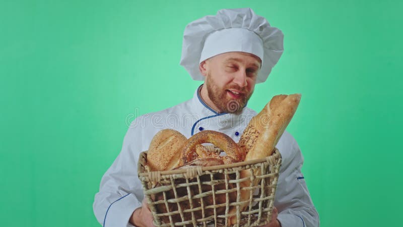 Baker Man in the Uniform Holding in Front of the Camera Basket of a ...