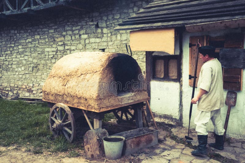 A Baker in a Medieval Fortress Bakes Bread Stock Image - Image of ...