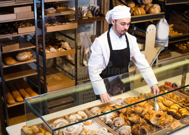 Professional Baker Offering Fresh Tasty Bun Stock Photos - Free ...