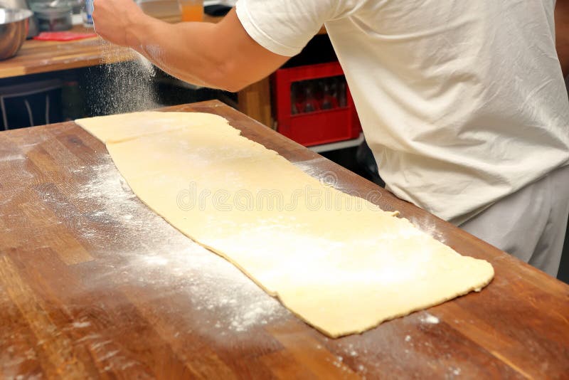 Baker Poured Flour on the Table for Rolling Dough Stock Photo - Image ...