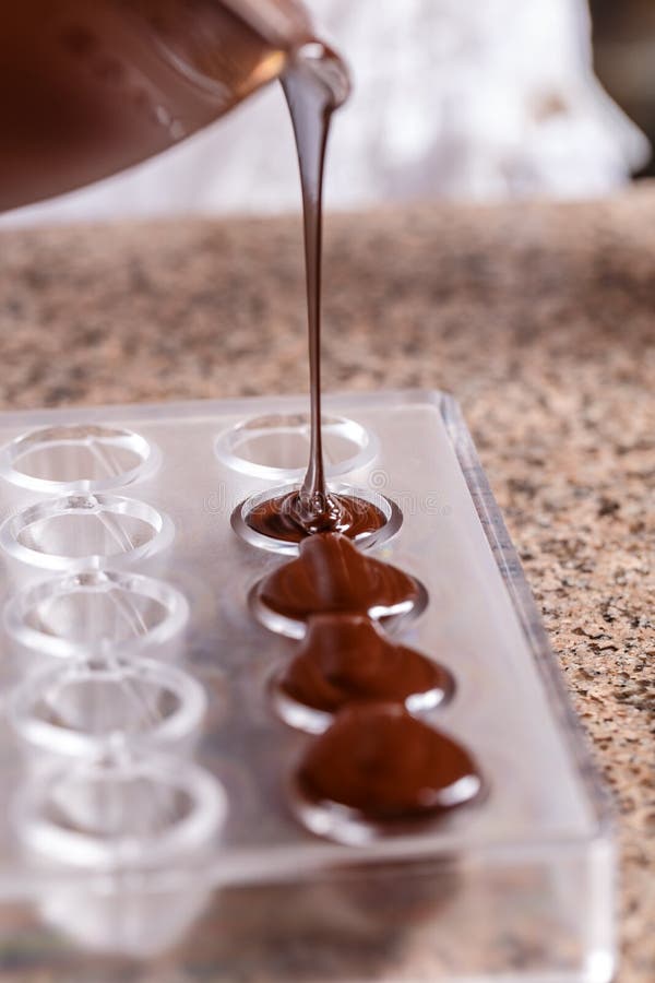 Baker pours chocolate stock photo. Image of tasty, taste - 77068494