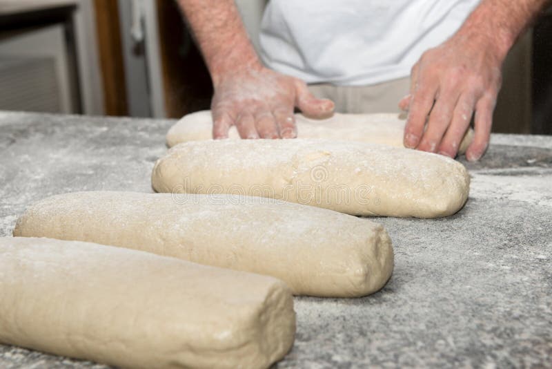 Baker prepares bread dough stock image. Image of bakery - 100280627
