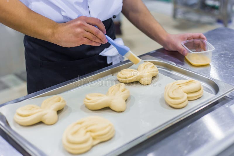 Baker Preparing Dough for Baking Heart Shaped Buns at Bakery Stock ...