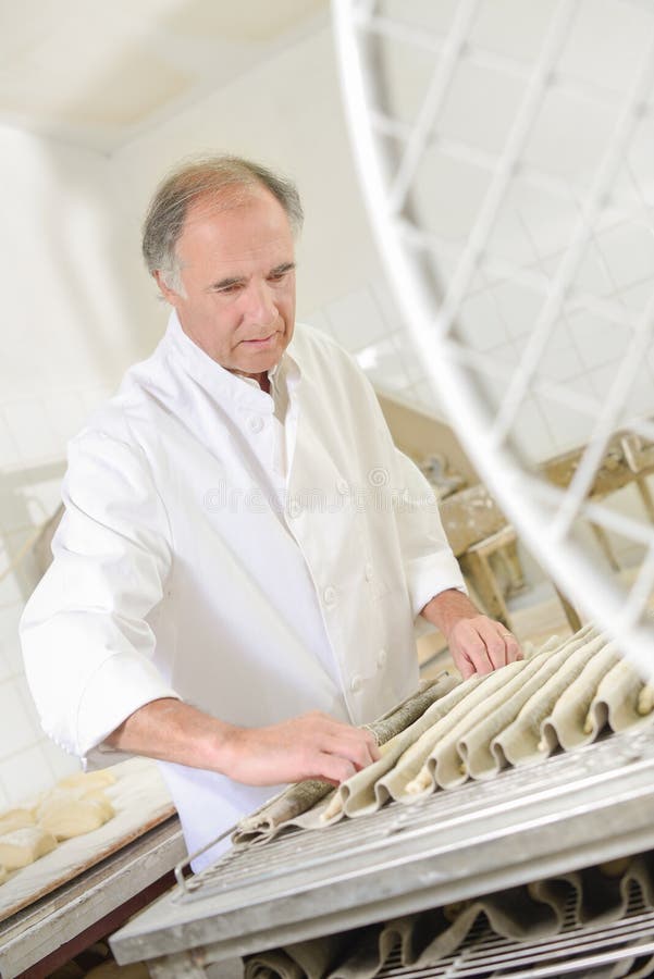 Baker preparing pastry stock image. Image of fold, kitchen - 174011365