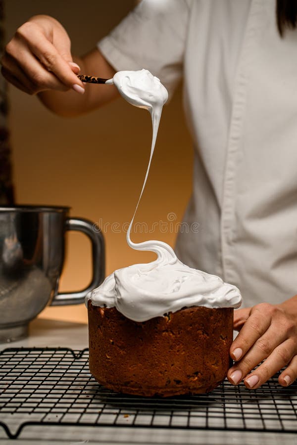 Baker Puts with Spoon White Cream on the Easter Cake Stock Photo ...