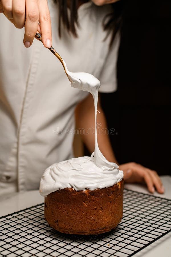 Baker Puts White Cream on the Easter Cake Stock Photo - Image of ...