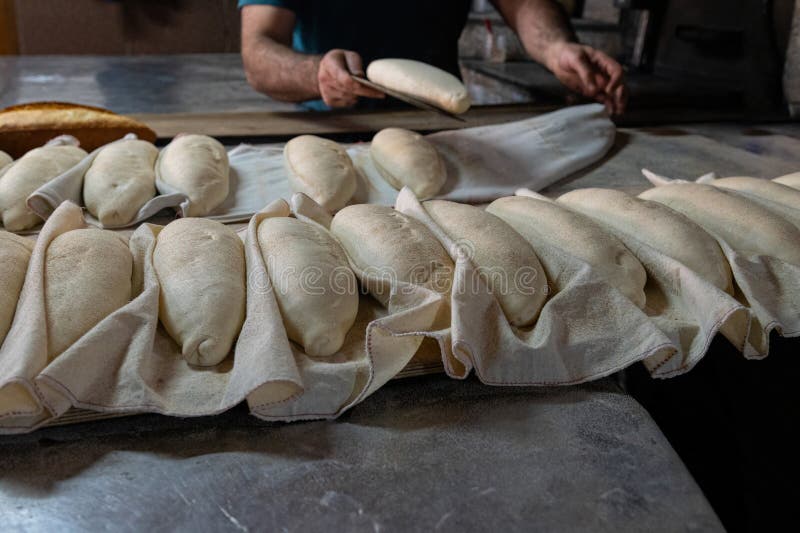 The Baker Putting the Bread Dough into the Oven Stock Image - Image of ...