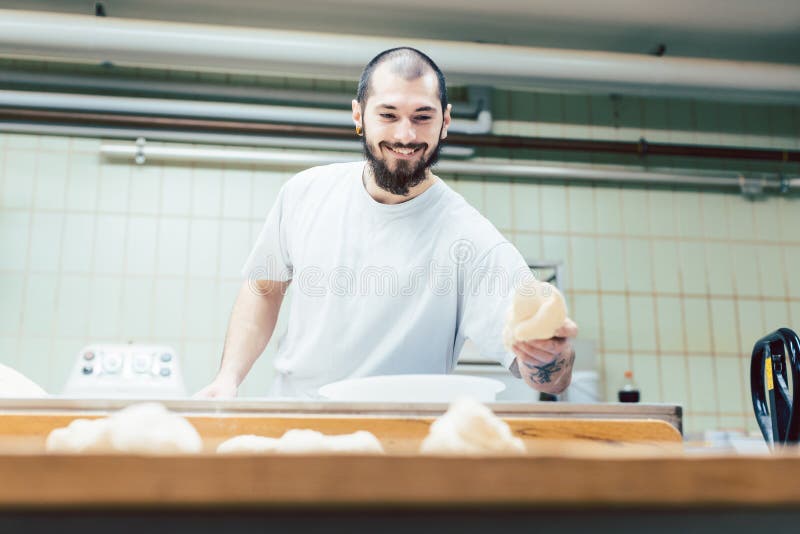 Baker with Raw Bread in the Bakery Stock Photo - Image of baking ...
