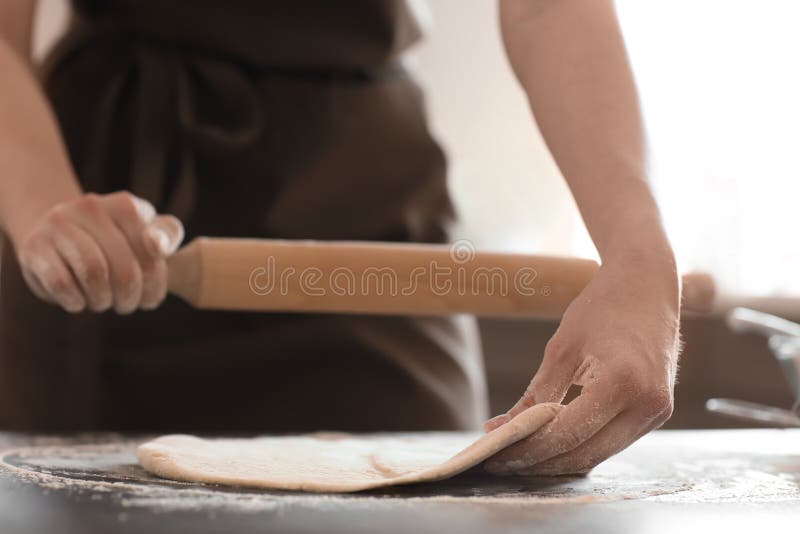 Baker Rolling Dough with Rolling Pin in Bakery Stock Photo - Image of ...