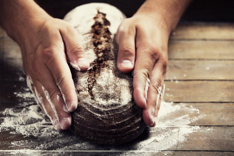 Baker Man Holding Rustic Loaf of Bread and Wheat in Hands Stock Photo ...