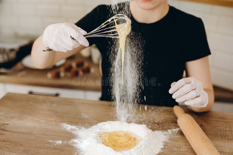 Baker S Hands with Plain Flour Well and Eggs in Preparation Process for ...