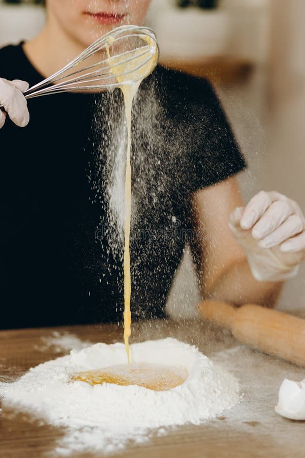 Baker S Hands with Plain Flour Well and Eggs in Preparation Process for ...