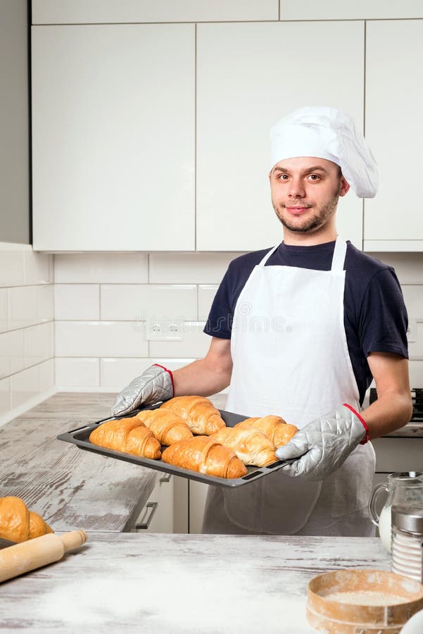 Baker showing croissant stock photo. Image of manufacture - 85789480