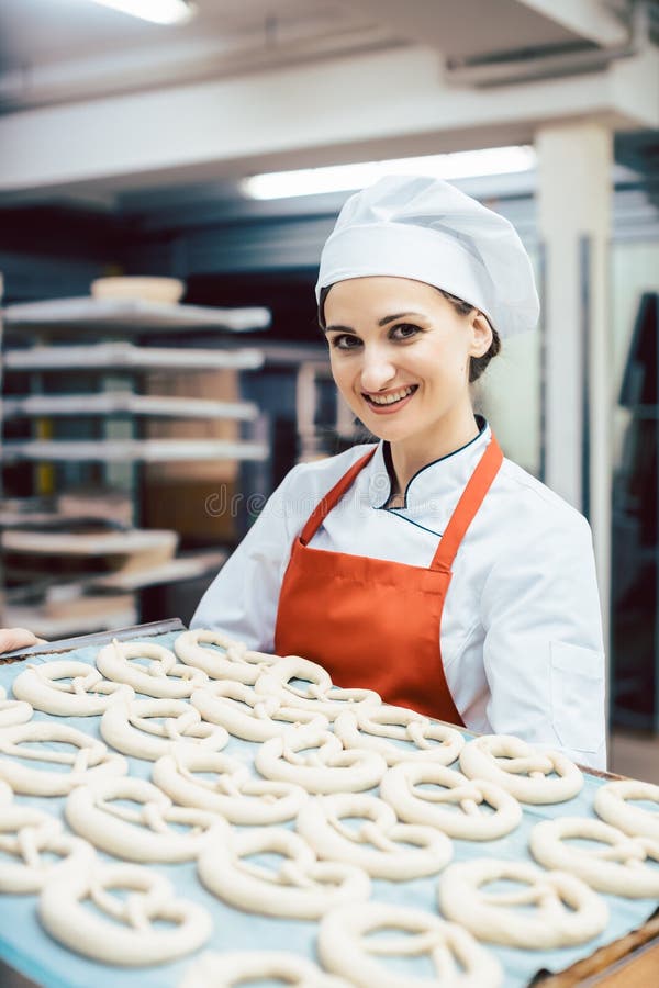Baker Showing Sheet with Bread Ready To Be Baked Stock Photo - Image of ...