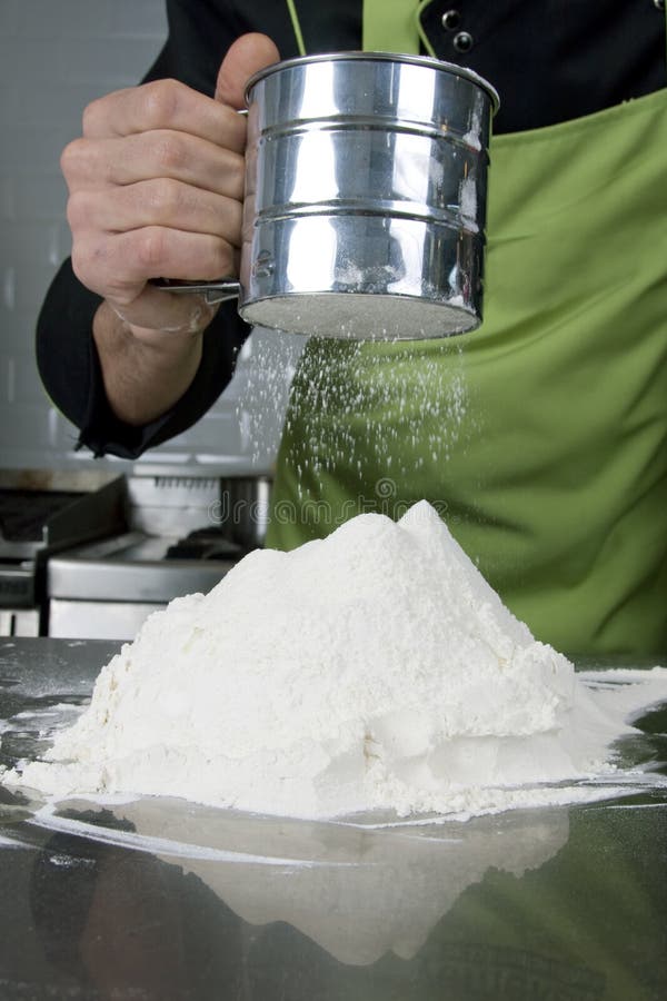 Baker sieving flour stock photo. Image of pasta, bake - 18818520