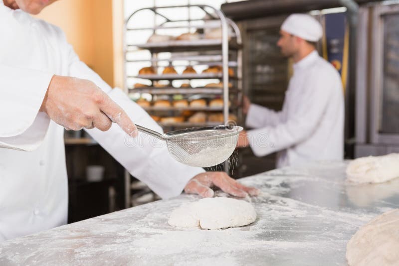 Baker Sieving Flour on the Dough Stock Photo - Image of catering ...