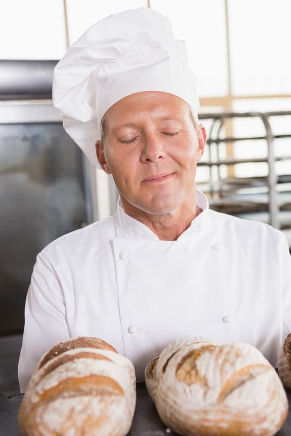 Baker Smelling Freshly Baked Breads Stock Photo - Image of business ...