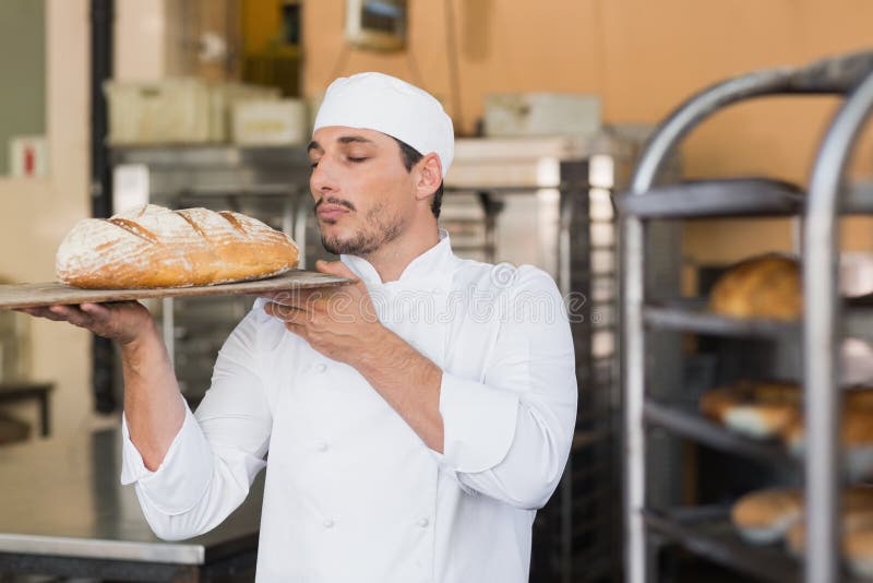 Baker Smelling Freshly Baked Breads Stock Photo - Image of business ...