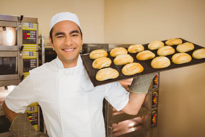 Baker Smiling at Camera Holding Tray of Rolls Stock Image - Image of ...