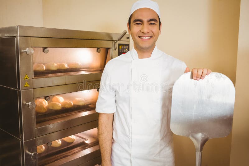 Baker Smiling at Camera beside Oven Stock Image - Image of school, view ...