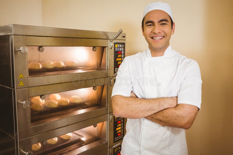Baker Smiling at Camera beside Oven Stock Photo - Image of front ...