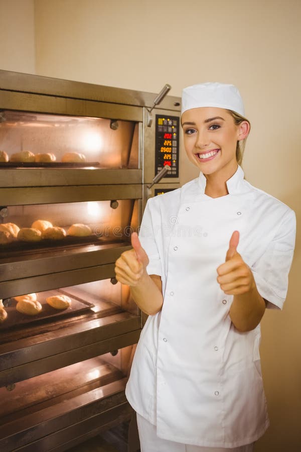 Baker Smiling at Camera beside Oven Stock Image - Image of whites, view ...