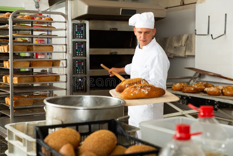 Baker Takes Out Hot Bread from Oven Stock Image - Image of frenchman ...