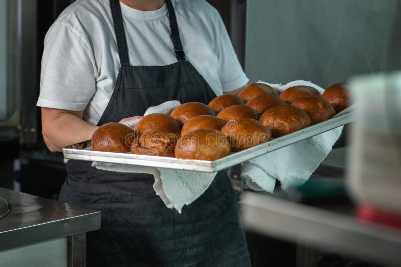 Baker Taking Baked Buns Out of the Oven Stock Image - Image of ...
