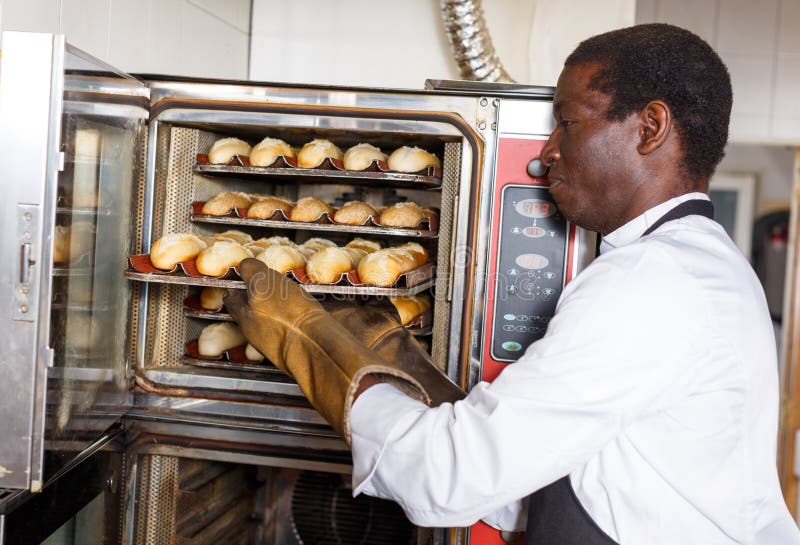 Baker Taking Out Bread from Oven Stock Image - Image of assortment ...