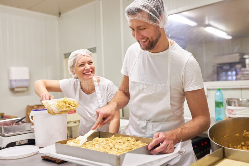 Baker Team Baking Apple Pie in Teamwork Stock Image - Image of happy ...