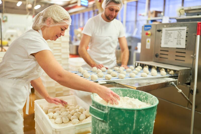 Baker Team Kneading Small Rolls in Large Bakery Stock Image - Image of ...