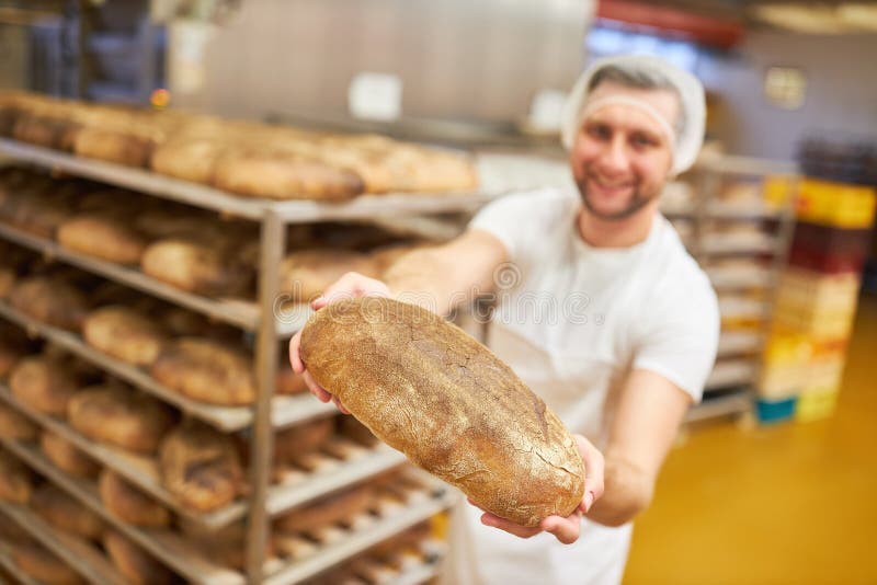 Baker Trainee Proudly Shows a Ready-baked Bread Stock Image - Image of ...