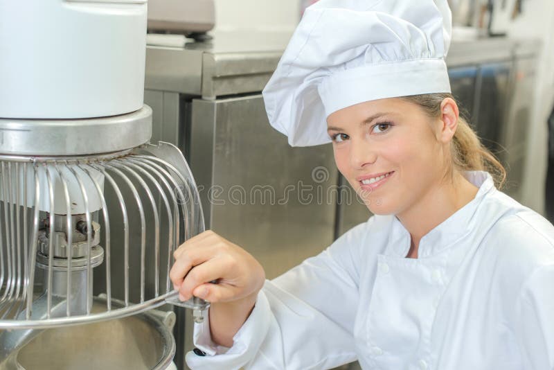Baker using mixing machine stock image. Image of bakery - 84629189