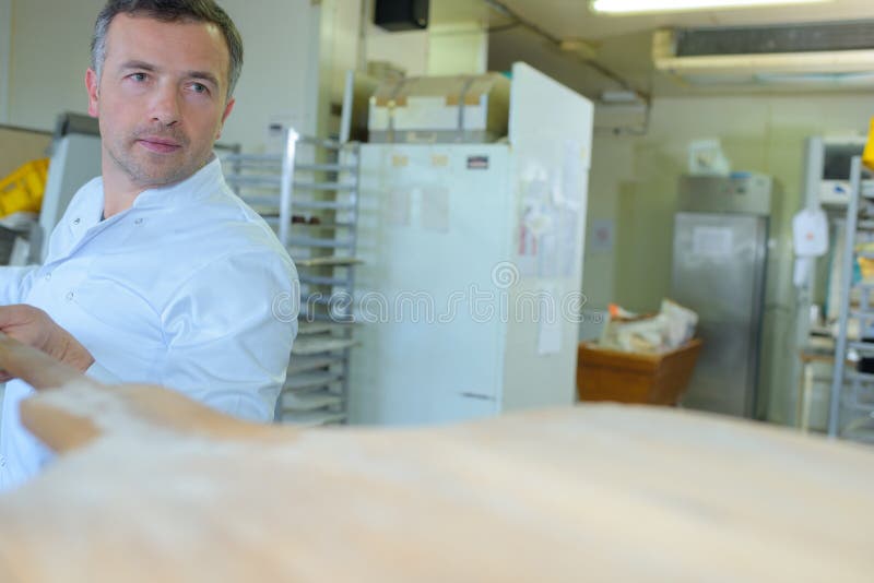 Baker using a peel stock photo. Image of kitchen, worker - 120763556