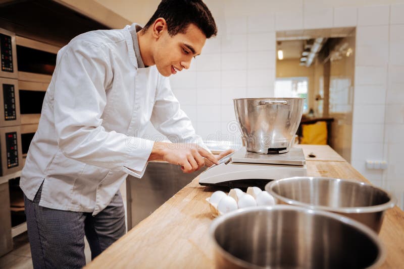 Baker Wearing White Jacket Using Modern Kitchen Scales Stock Image ...