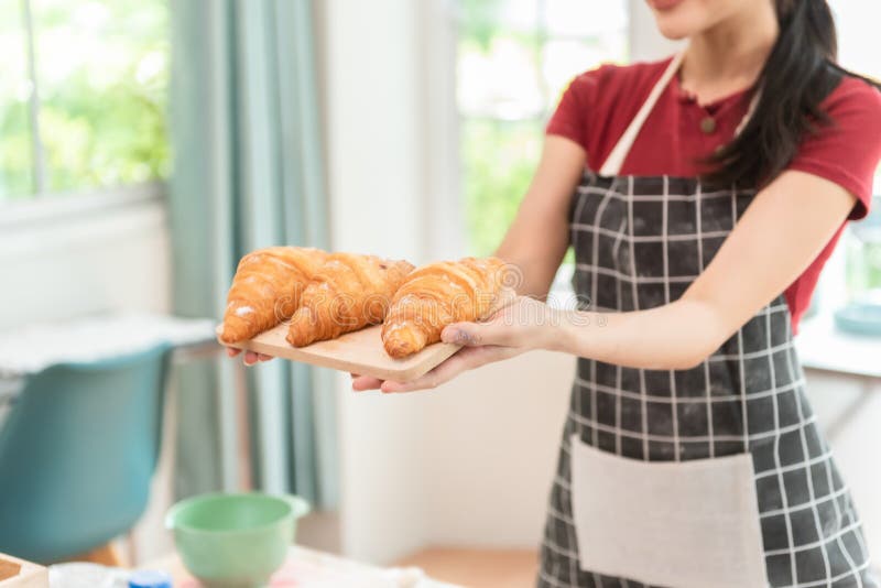 Baker Woman Presenting Bread on Board in Bakery Looking Proudly into ...