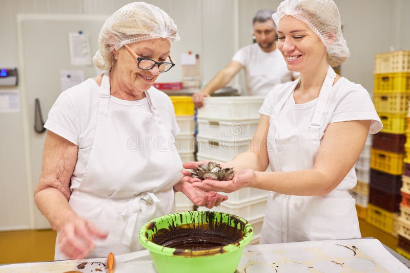 Baker Women Team Baking Madeleine Biscuits Stock Image - Image of ...